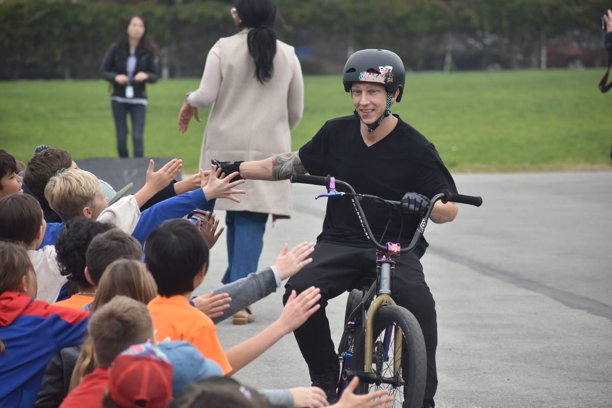 BMX pros bring energy, messaging to Roosevelt students
